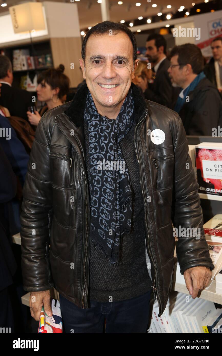 Thierry Beccaro poses during the Book Fair 'Le Salon Du Livre' held at ...