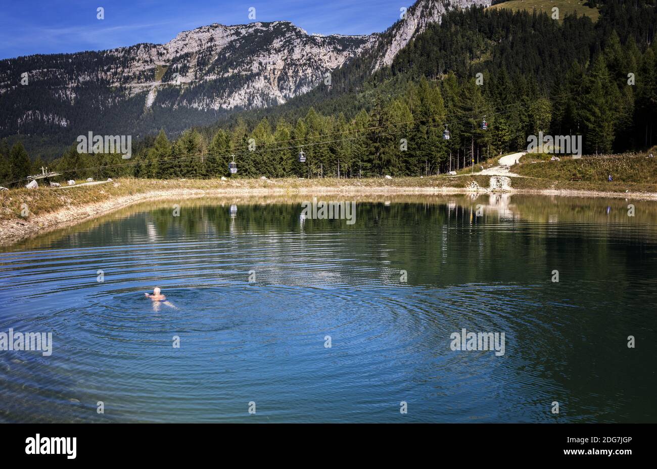 Swimming in the mountain lake Stock Photo - Alamy