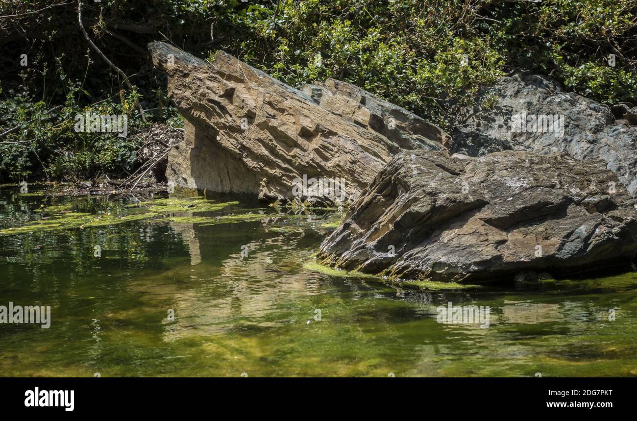 Rocks in water Stock Photo - Alamy