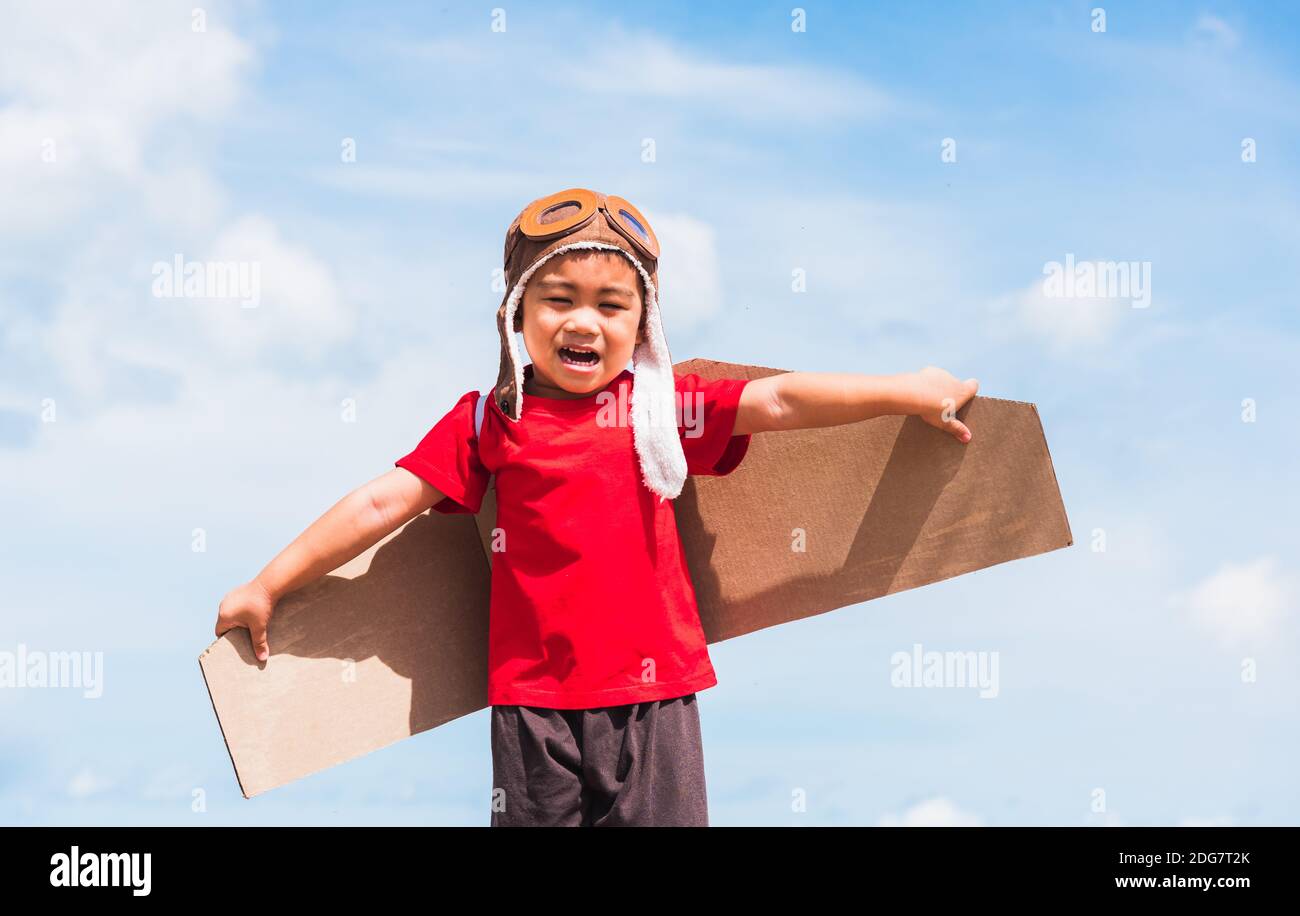 Happy Asian funny child or kid little boy smile wear pilot hat play and ...