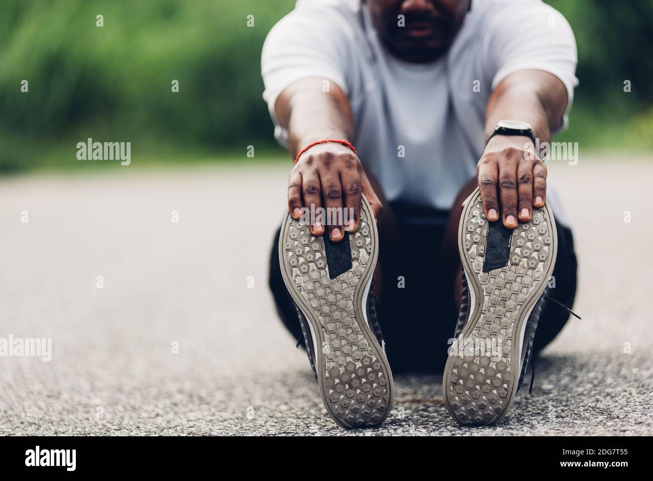 Close up Asian young athlete sport runner black man wear watch he ...