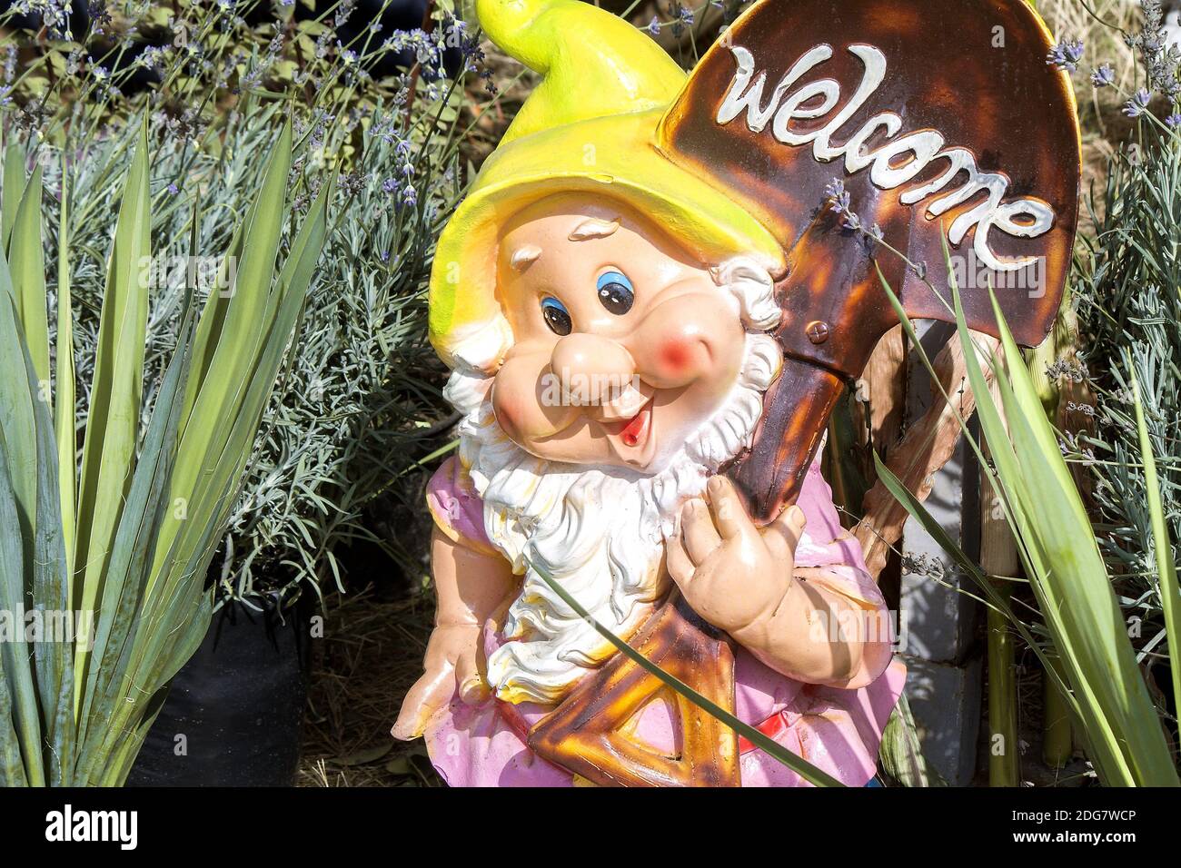 Figure fun funny dwarf in a top hat and with a shovel Stock Photo - Alamy