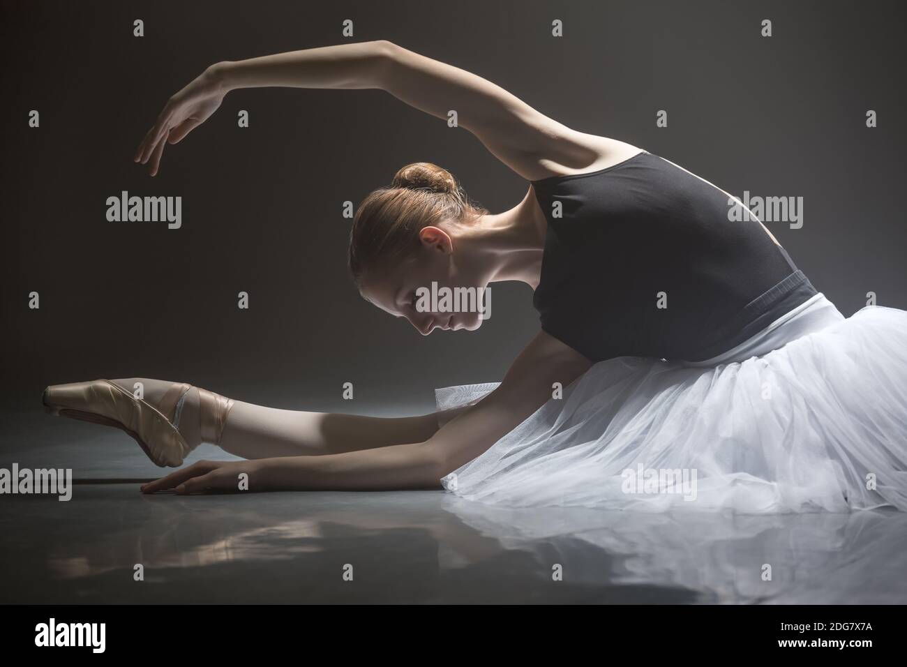 Seated ballerina in class room Stock Photo - Alamy