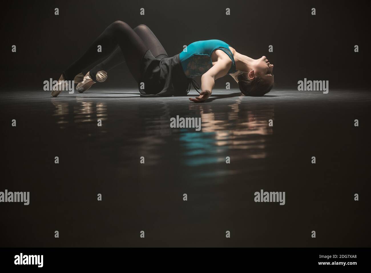 Ballet dancer lying on the floor Stock Photo - Alamy