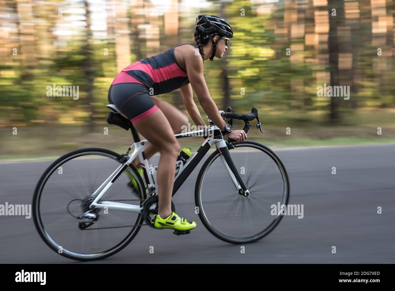 Athletic girl rides a bike Stock Photo - Alamy