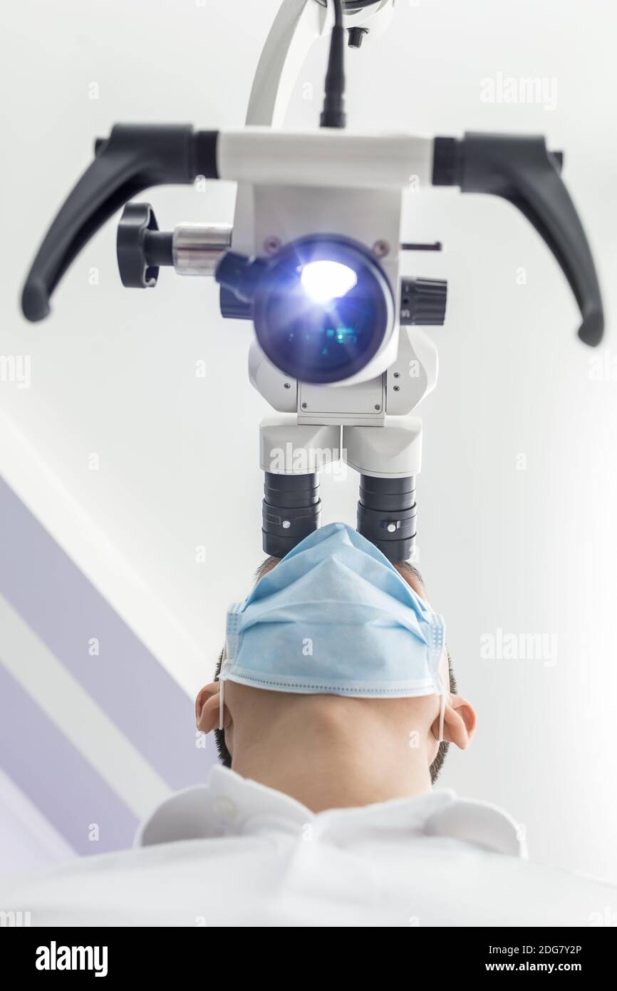 Using a dental microscope Stock Photo - Alamy