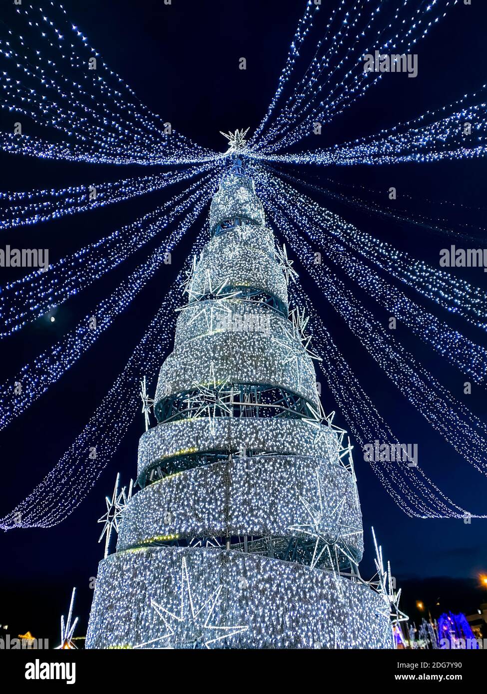new year tree with christmas lights decoration. winter holiday ...