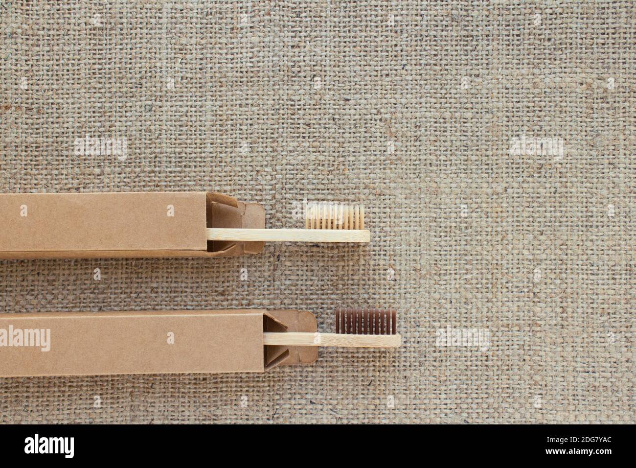 Mockup image of natural bamboo toothbrushes in paper packaging boxes on ...