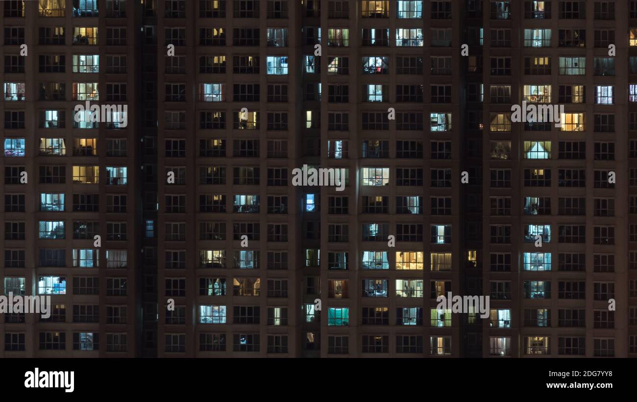 High-rise apartment block at night Stock Photo - Alamy