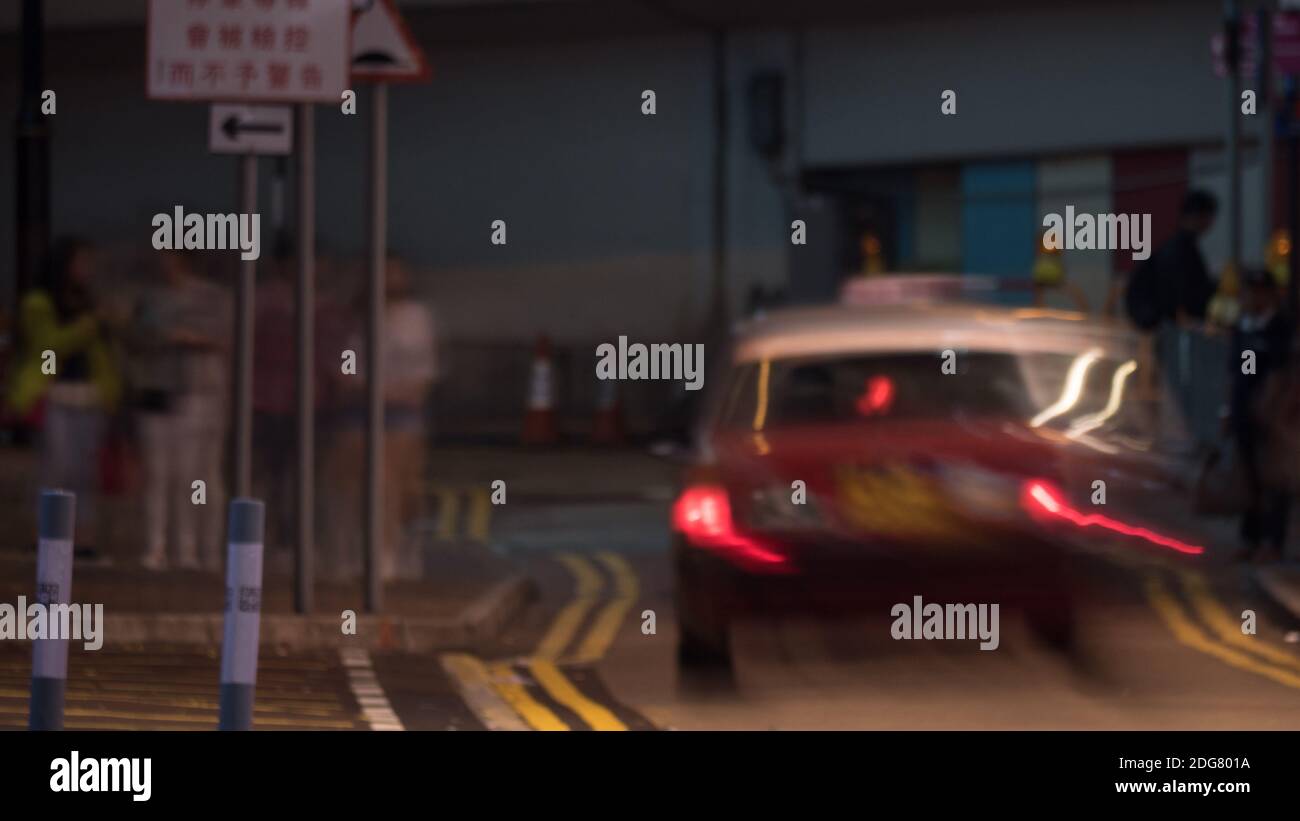 Taxi car driving along night road Stock Photo - Alamy