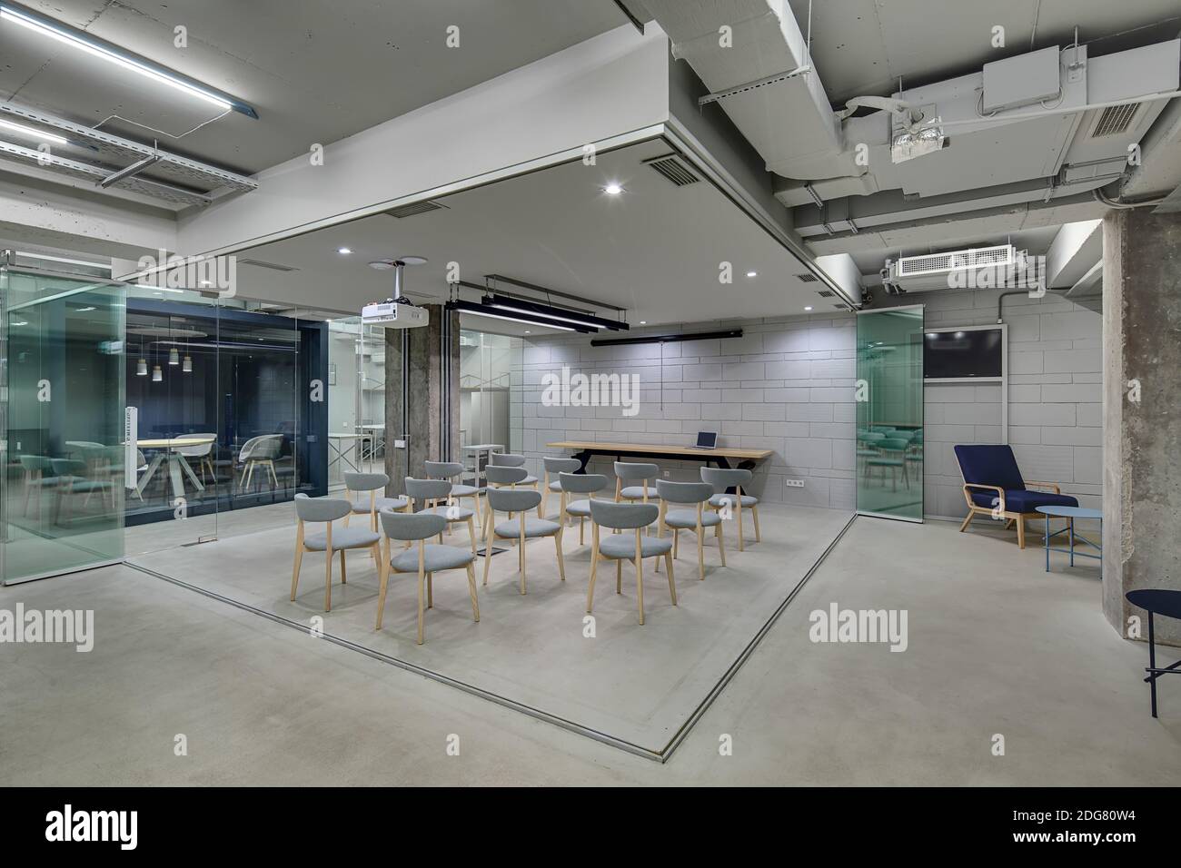 Glowing office in loft style Stock Photo - Alamy