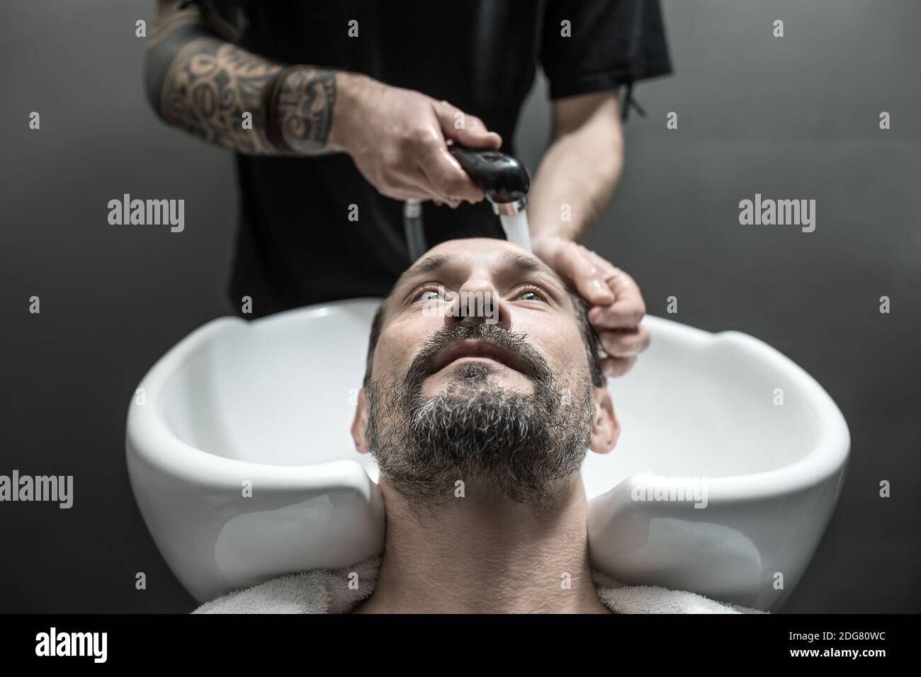 Washing head in barbershop Stock Photo - Alamy