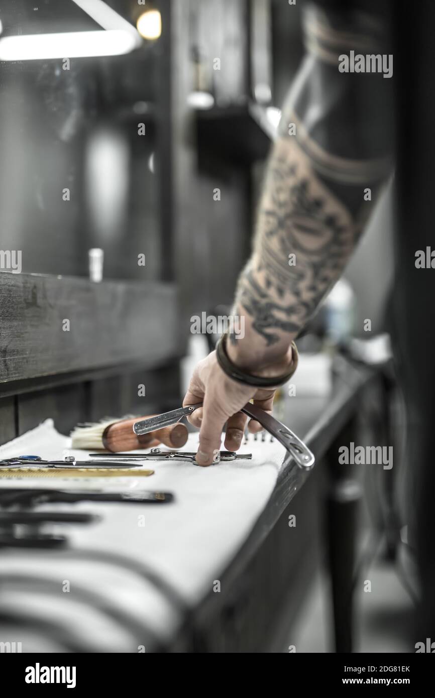 Hand with straight blade Stock Photo - Alamy