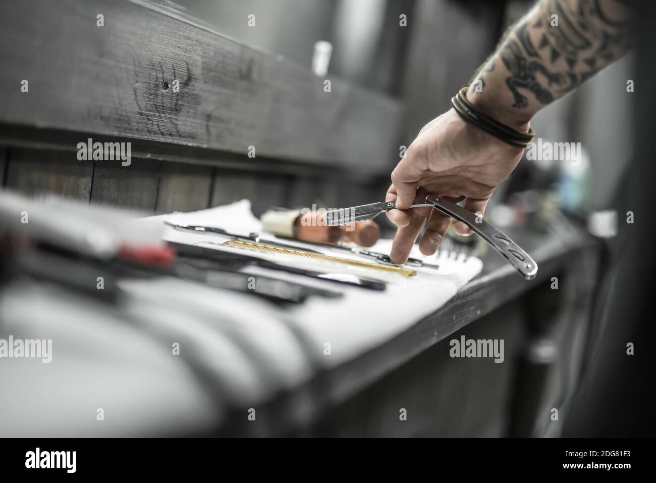 Hand with straight blade Stock Photo - Alamy