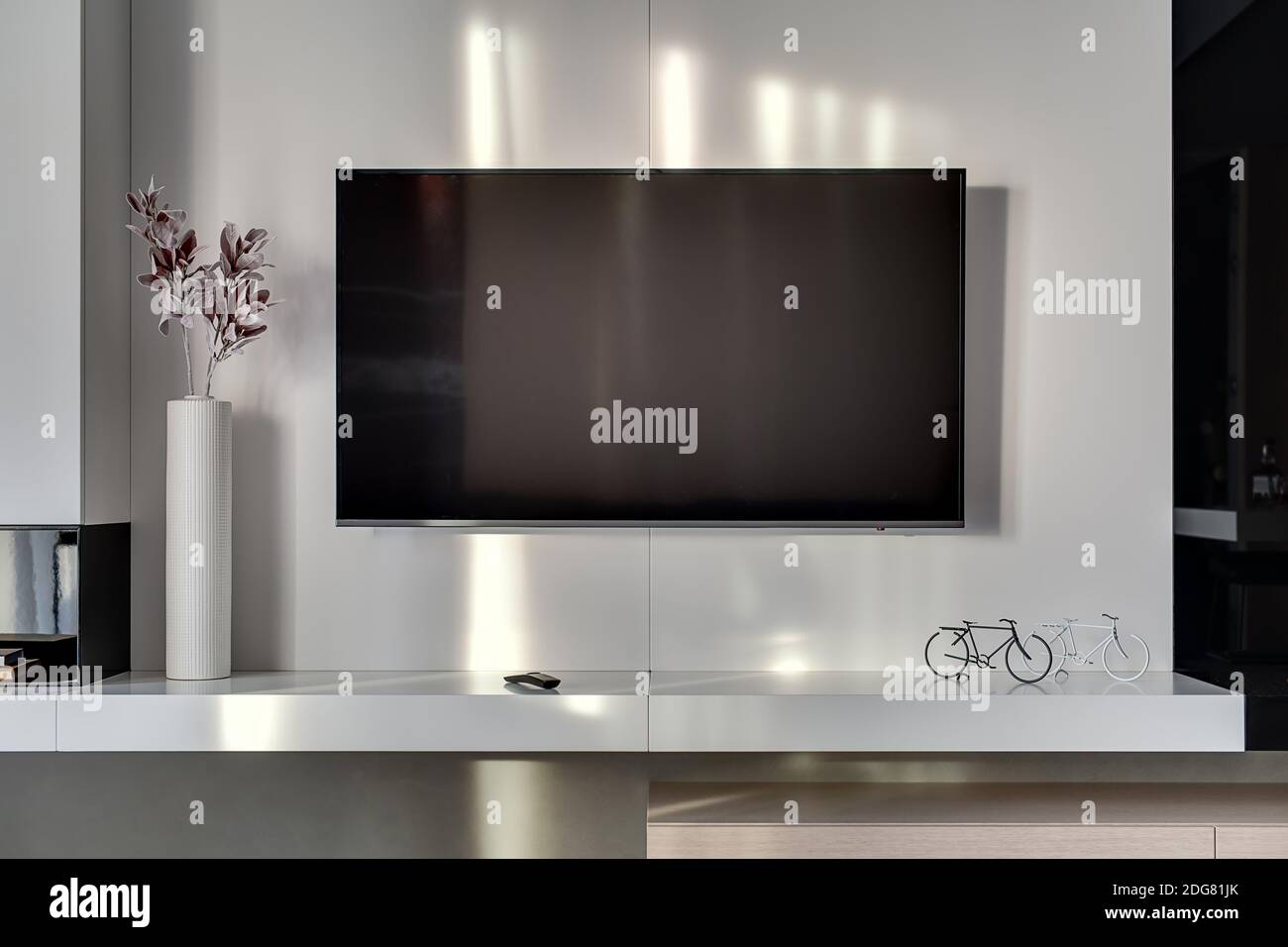 TV on the wall Stock Photo - Alamy