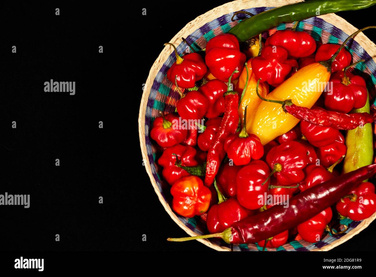 Red hot chilli peppers on black background Stock Photo - Alamy