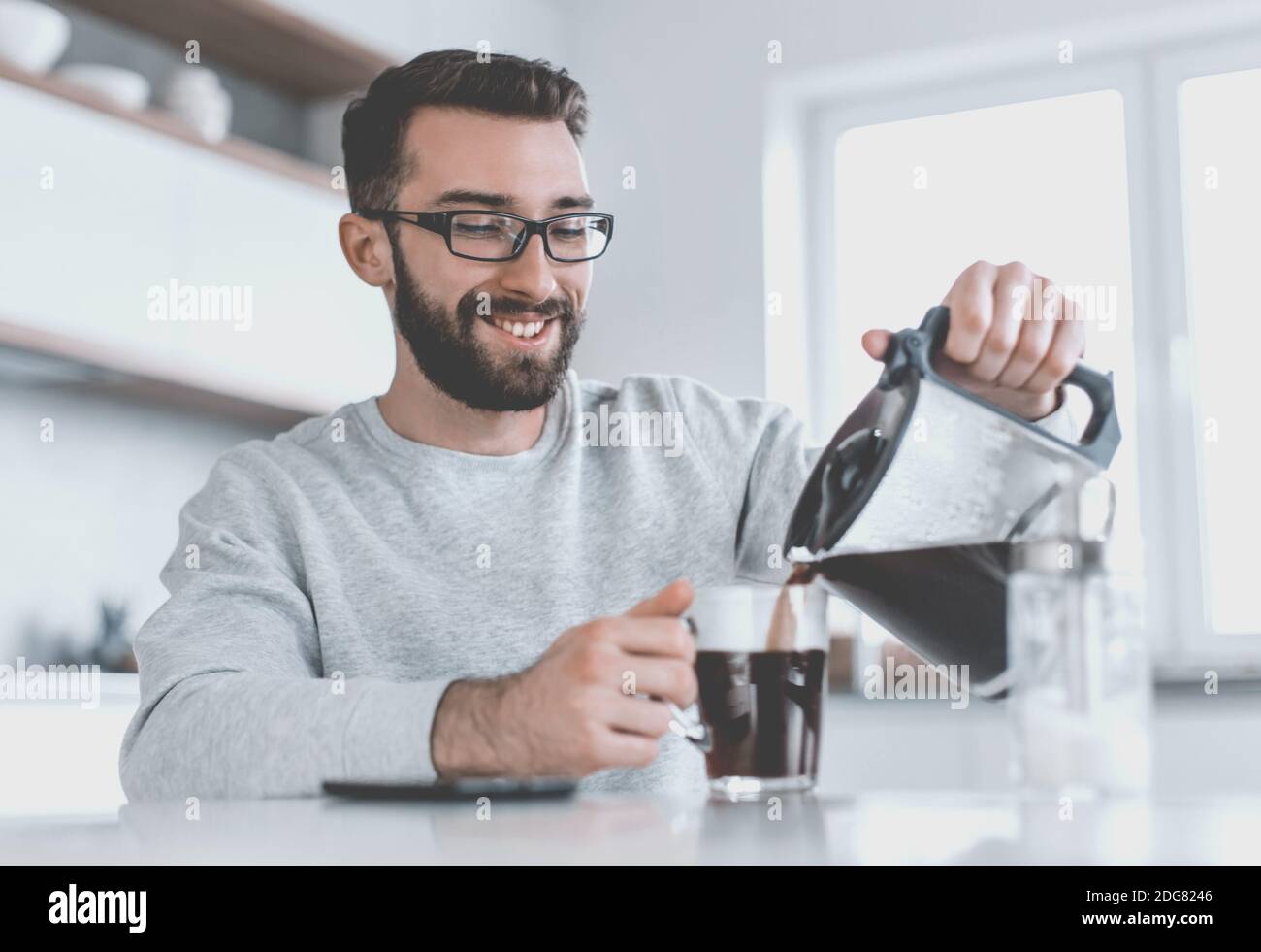 Man pouring himself glass hi-res stock photography and images - Alamy