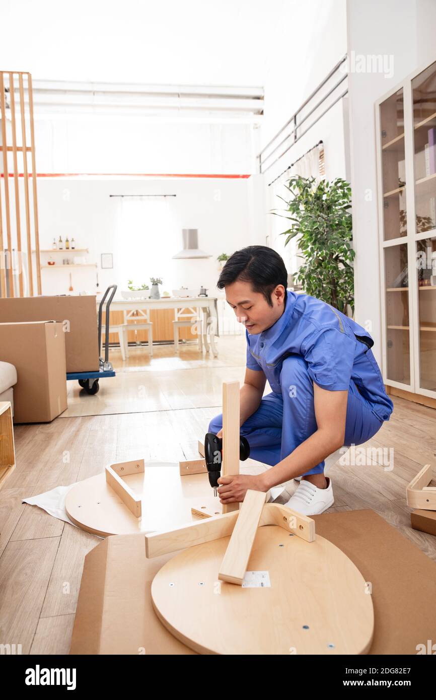 Home improvement service personnel to install the furniture Stock Photo ...