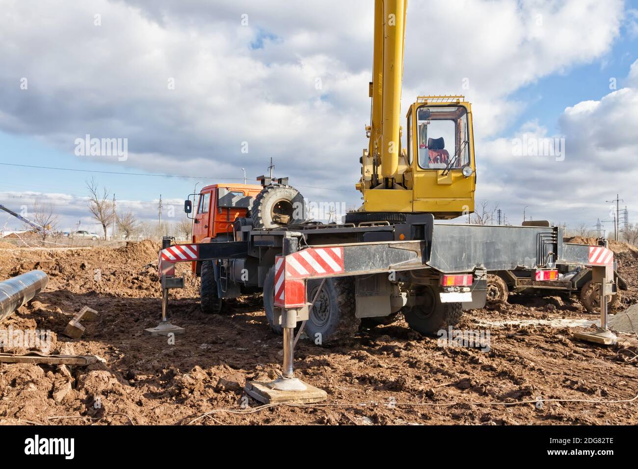 Laying of the main pipeline in the field using a truck crane Stock ...