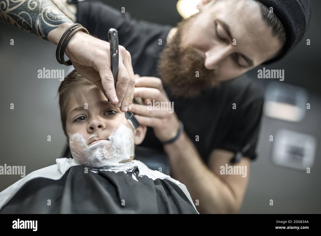 Humorous shaving of little boy Stock Photo - Alamy