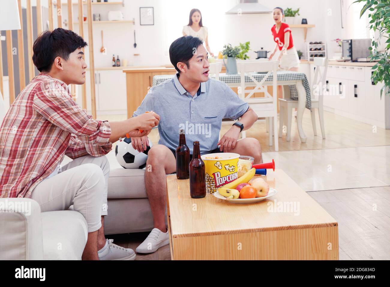 See a ball game friends at home Stock Photo - Alamy