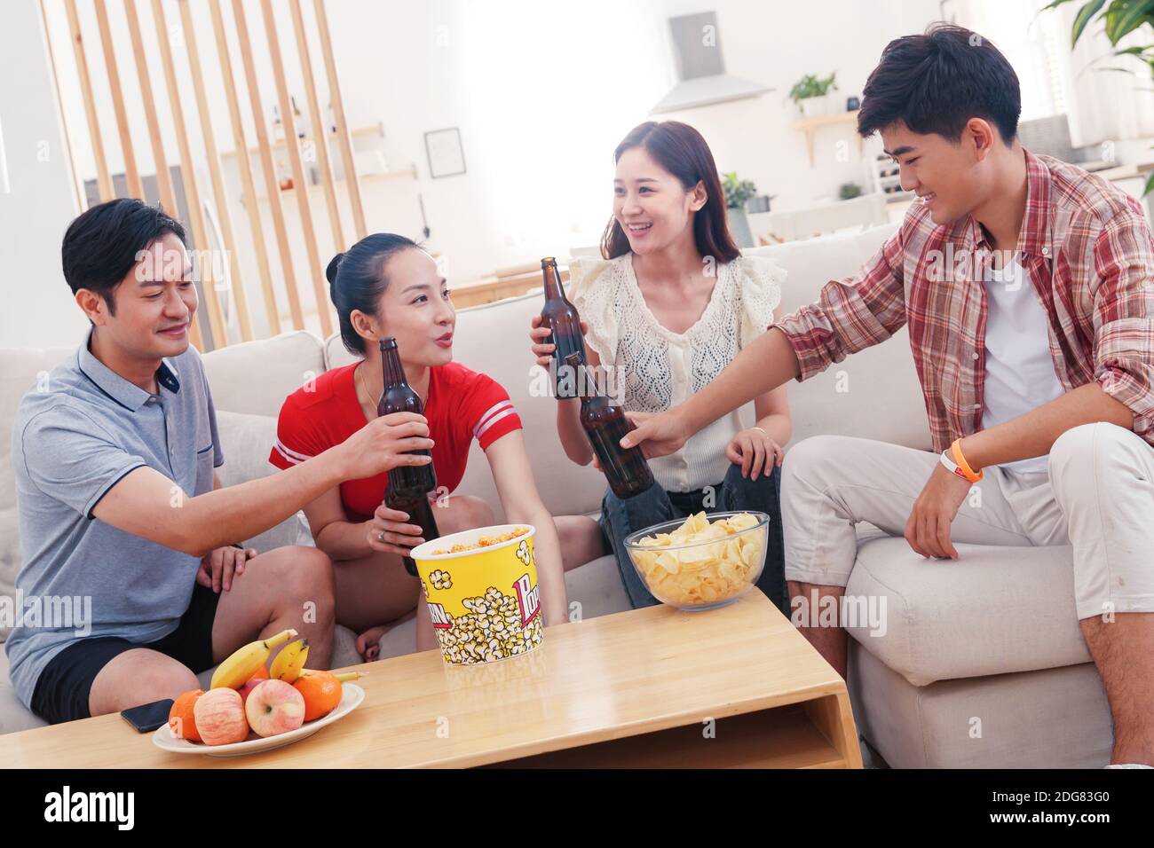 Friends sofa wine fruit hi-res stock photography and images - Alamy