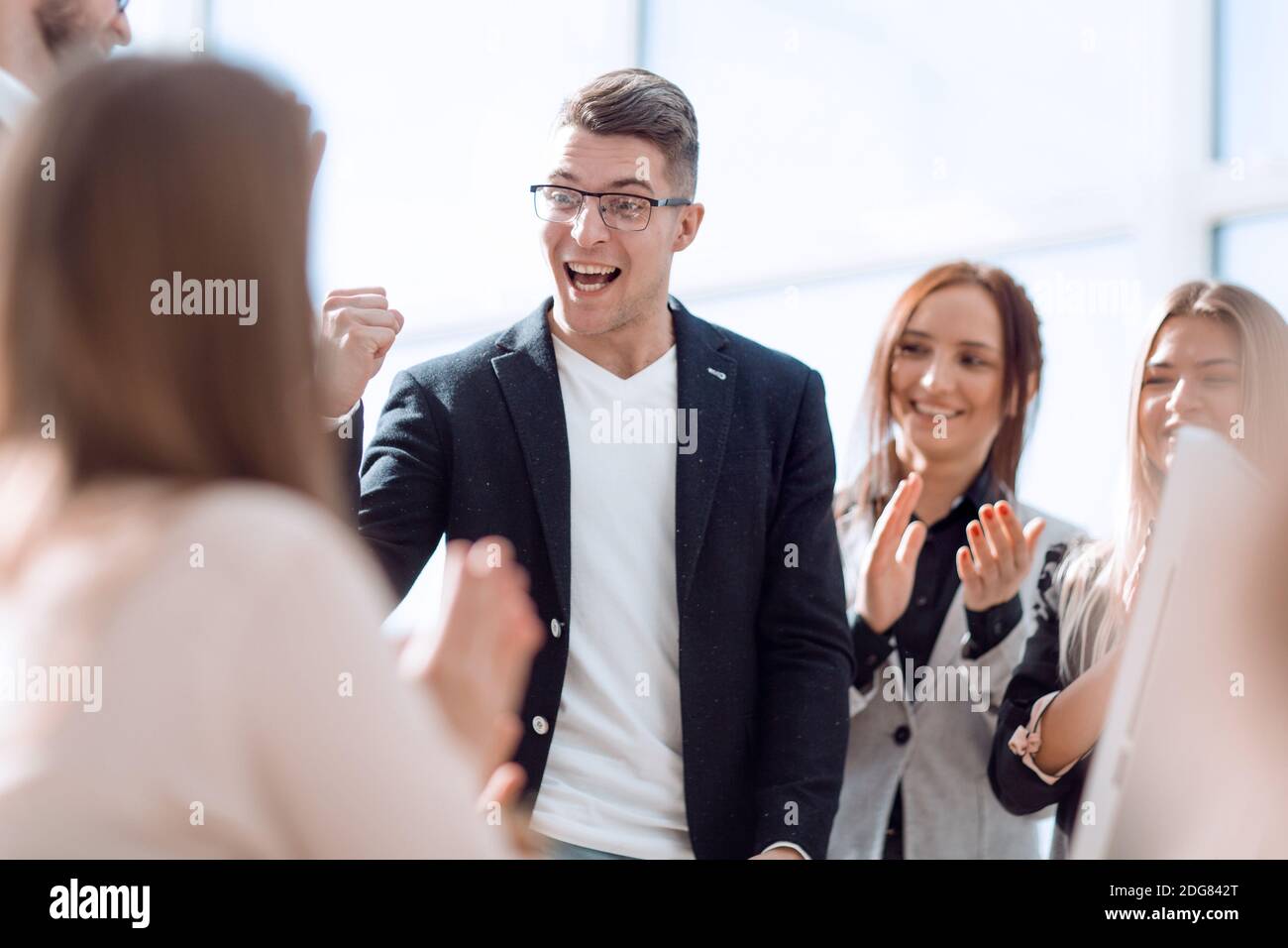 happy leader standing in front of his business team Stock Photo - Alamy