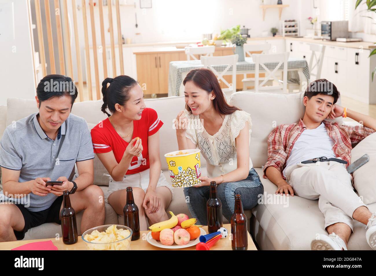 Happy young men watching game hi-res stock photography and images - Alamy