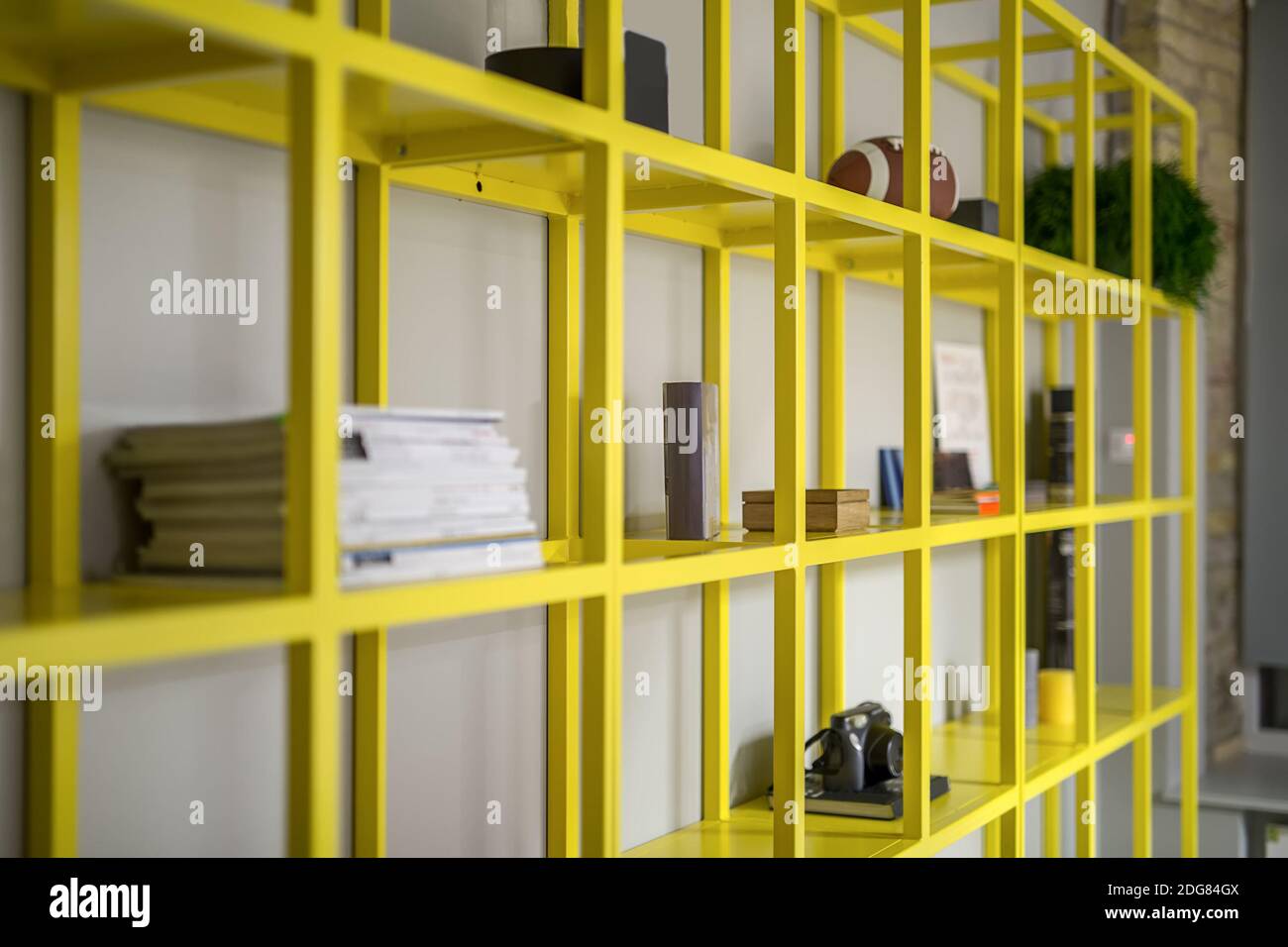 Yellow shelves with accessories Stock Photo - Alamy