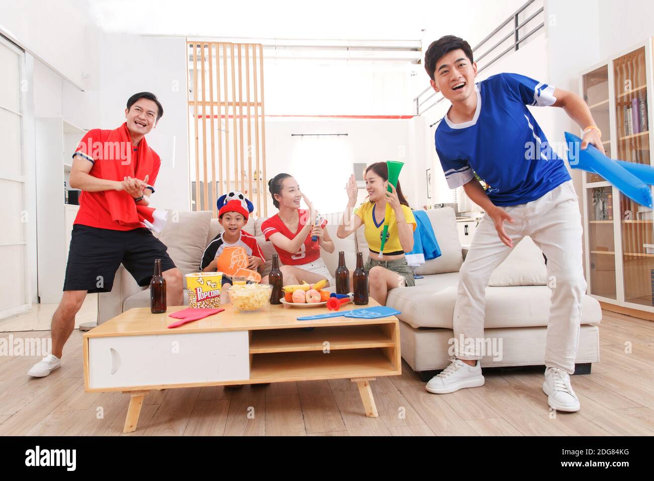 See a ball game fans friends at home Stock Photo - Alamy