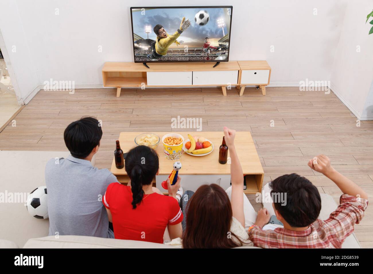 Rear view friends watching game hi-res stock photography and images - Alamy