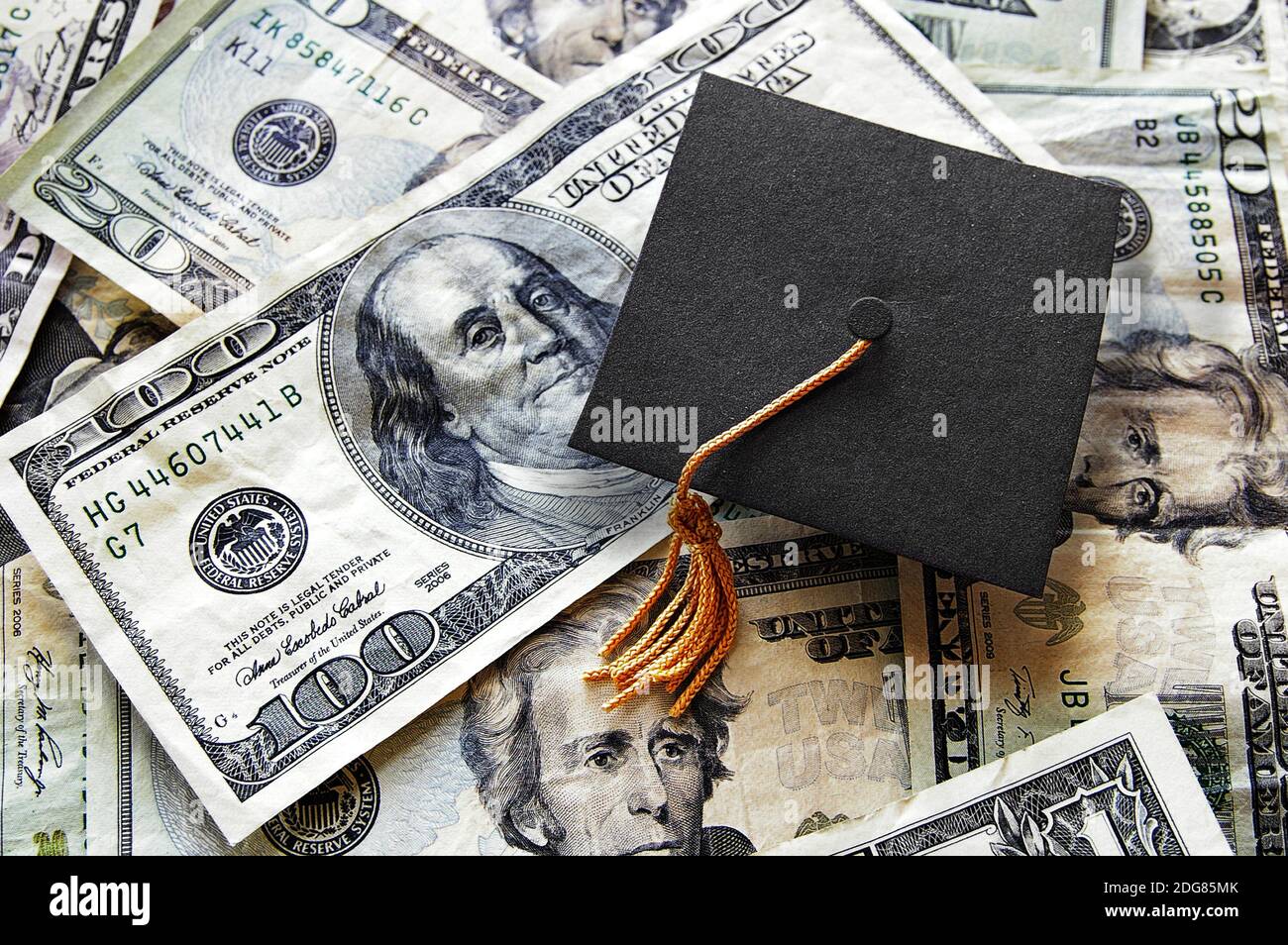 Grad cap on cash Stock Photo - Alamy