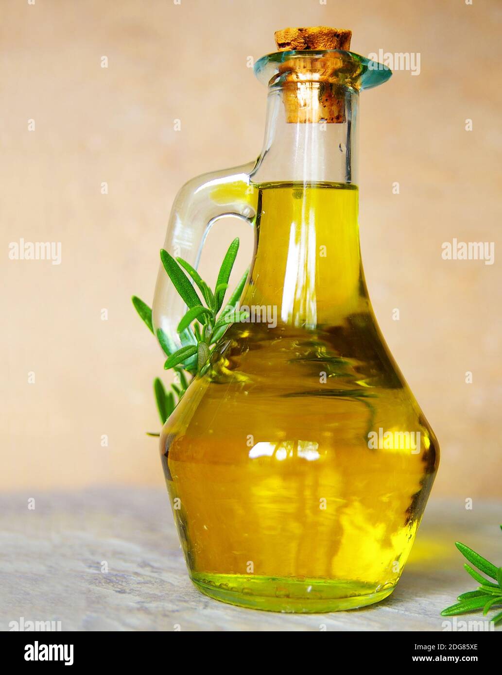 Olive oil in glass container Stock Photo - Alamy
