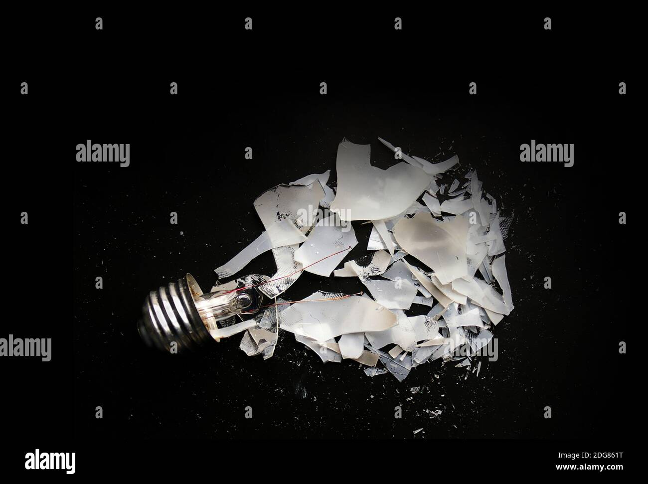 Smashed light bulb on black (old Stock Photo - Alamy
