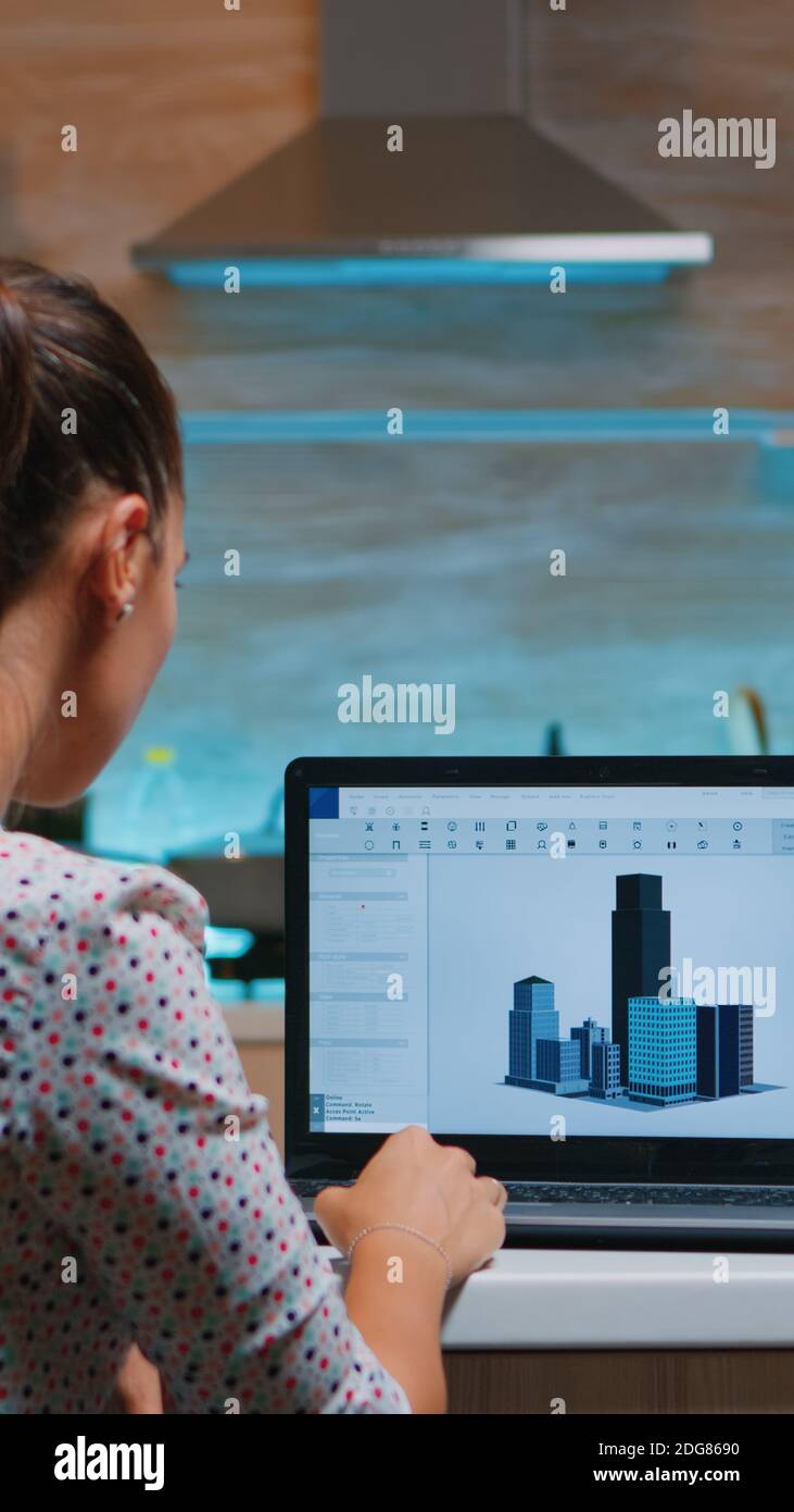 Designer using cad software to design a 3D concept of buildings working ...