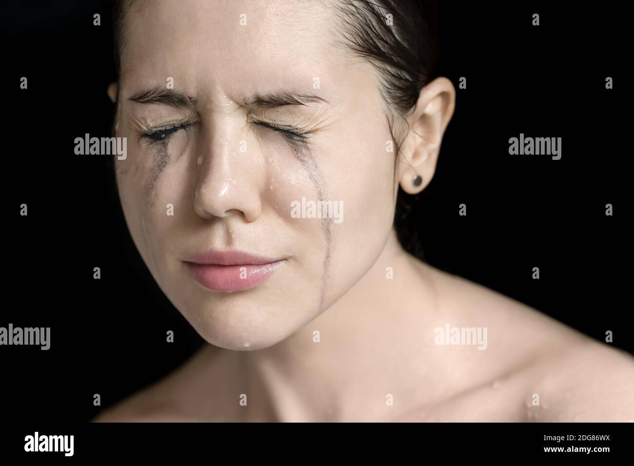 Studio portrait of wet woman Stock Photo - Alamy