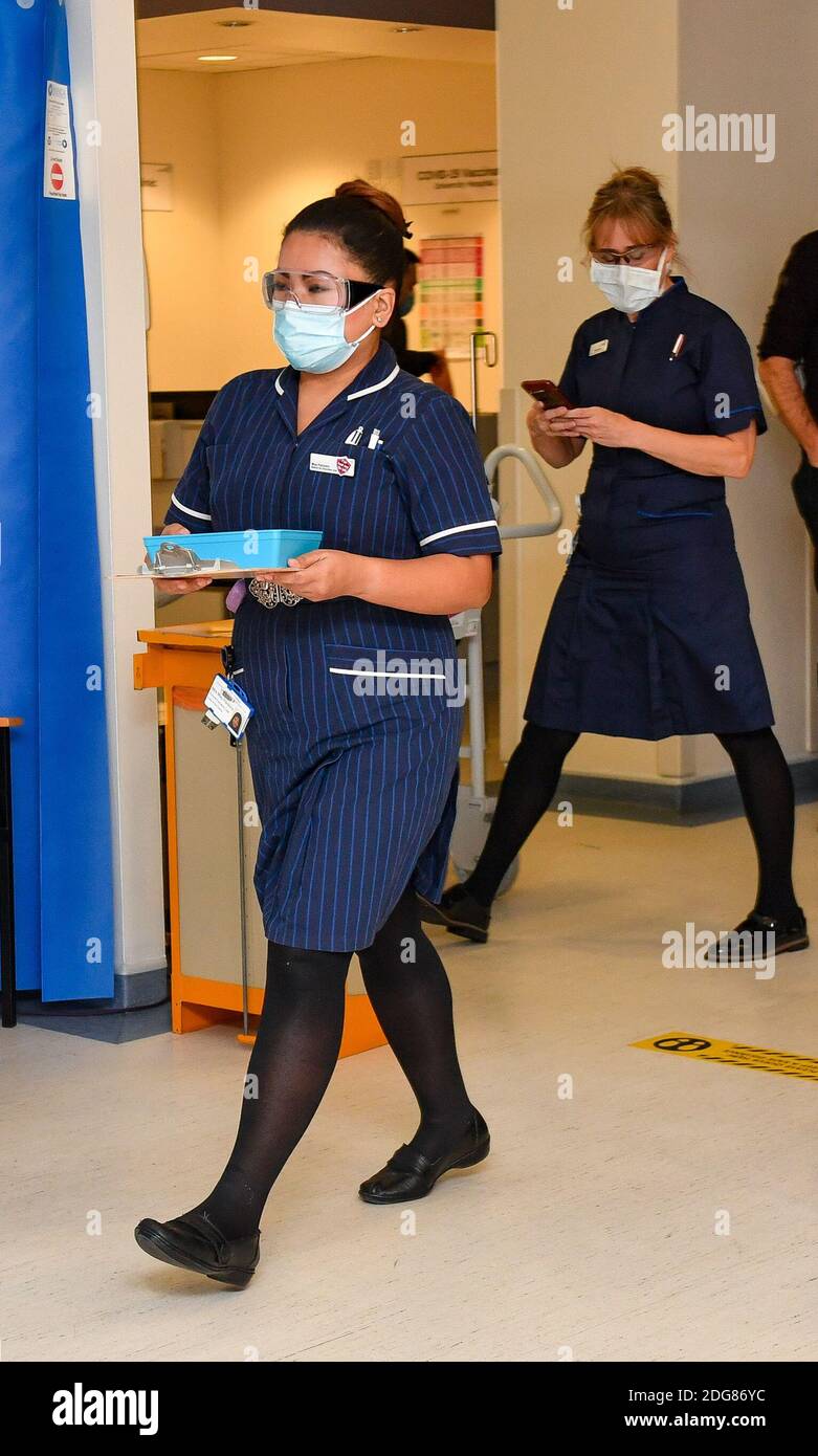 Nurse May Parsons carries the first Pfizer/BioNTech covid-19 vaccine at ...