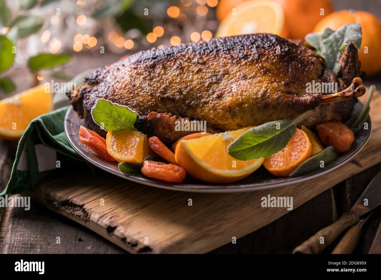 Winter Holiday table served for Christmas dinner with roasted duck ...