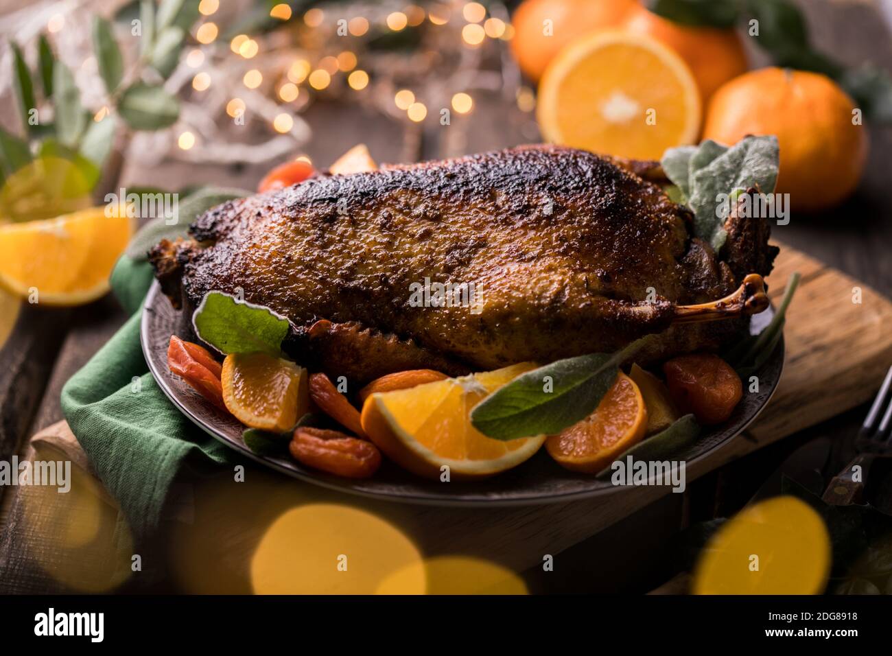 Winter Holiday table served for Christmas dinner with roasted duck ...