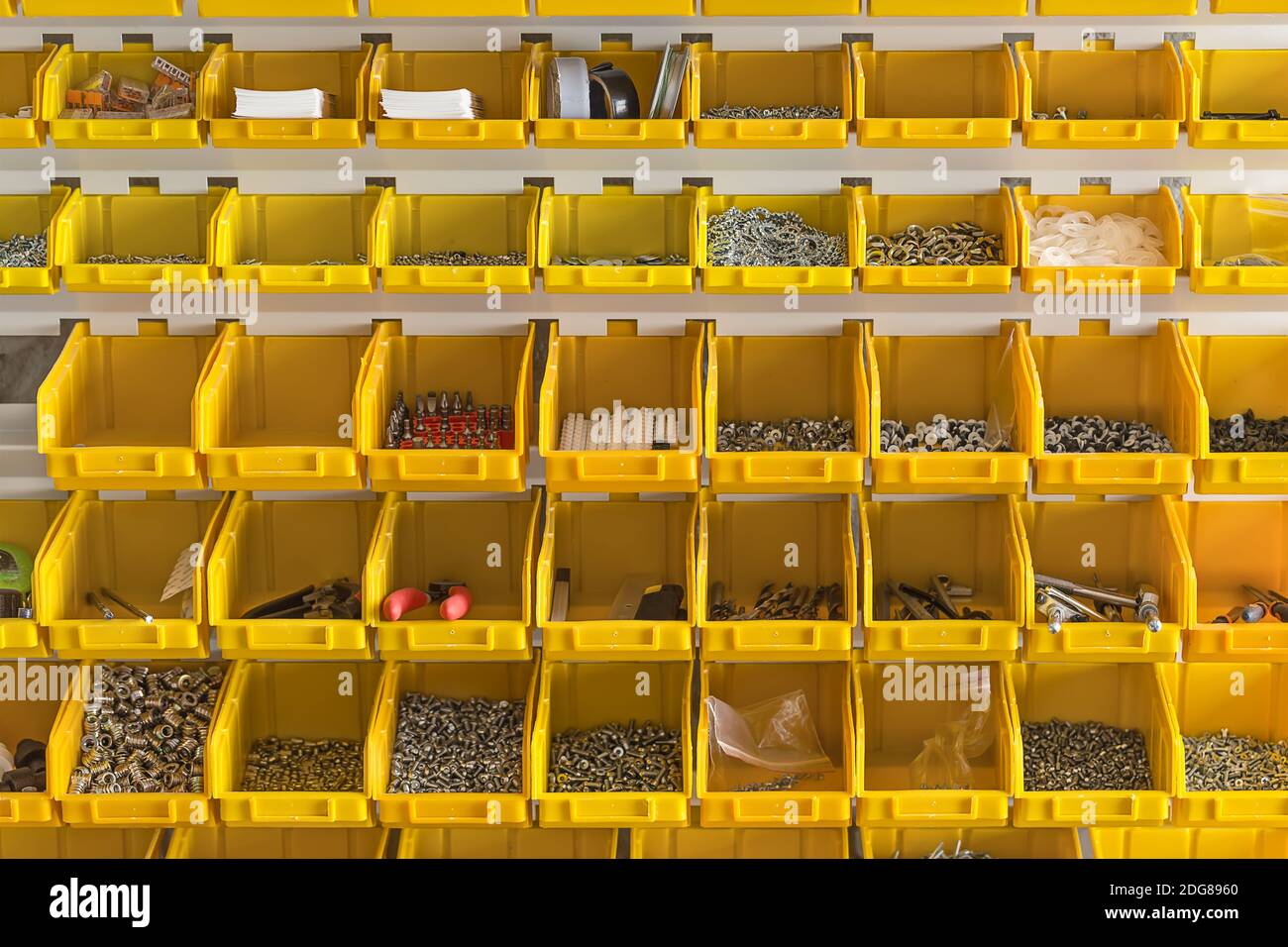 Plastic yellow boxes with instruments on wall Stock Photo - Alamy