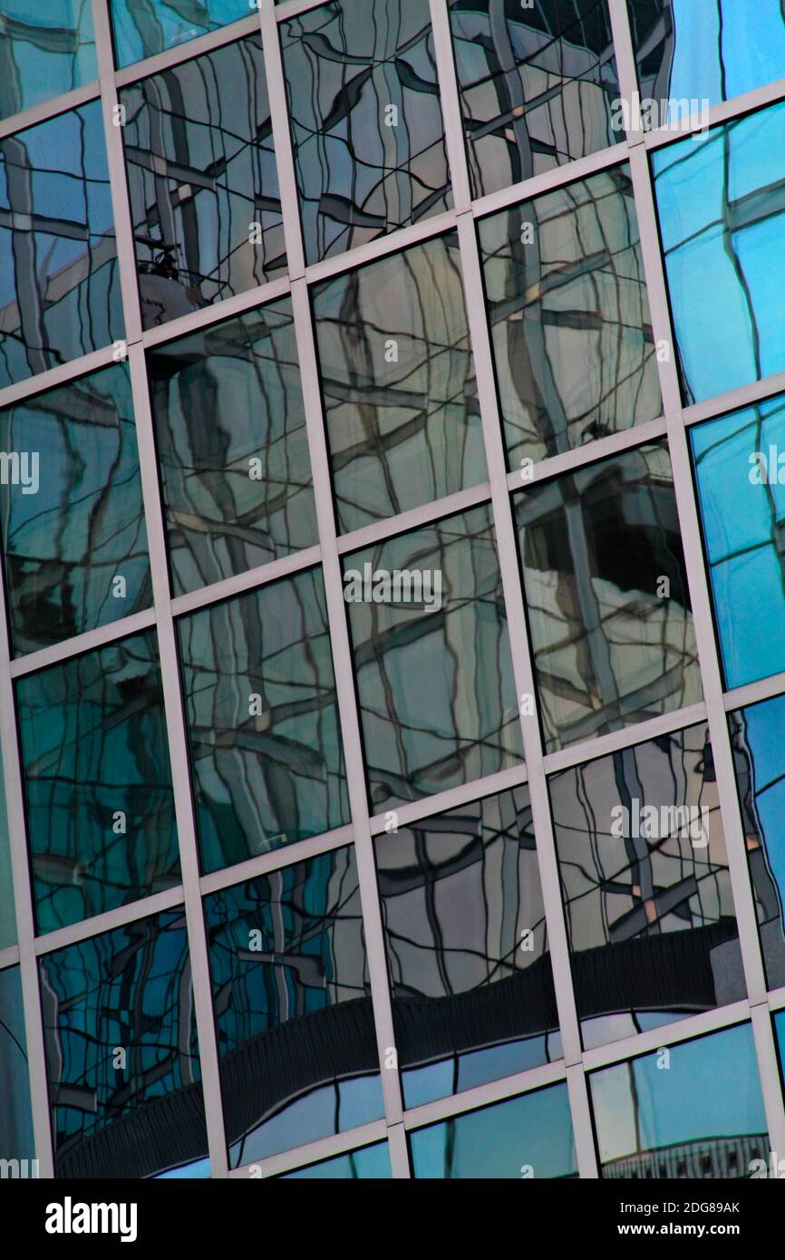 An urban building with reflective windows Stock Photo - Alamy