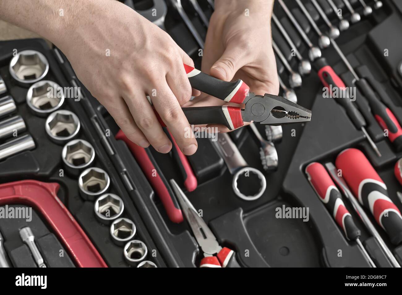 Open toolbox and male hands Stock Photo - Alamy