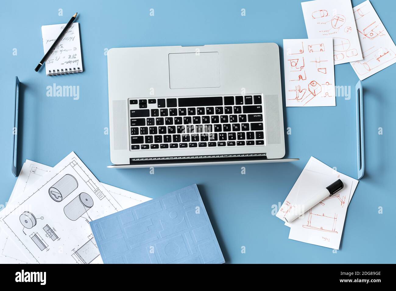 Blue table with laptop Stock Photo - Alamy