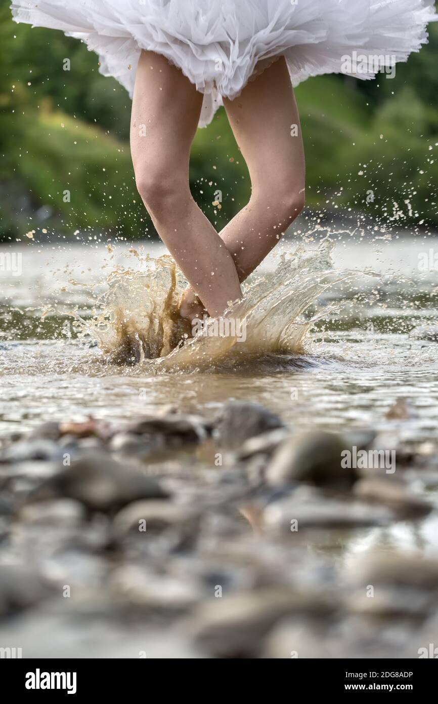 Girl jumping in river hi-res stock photography and images - Alamy