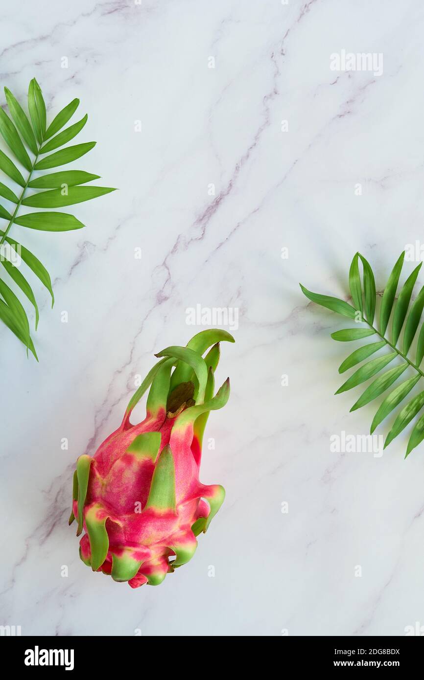 Fresh organic pink dragon fruit, pitaya or pitahaya, on marble ...