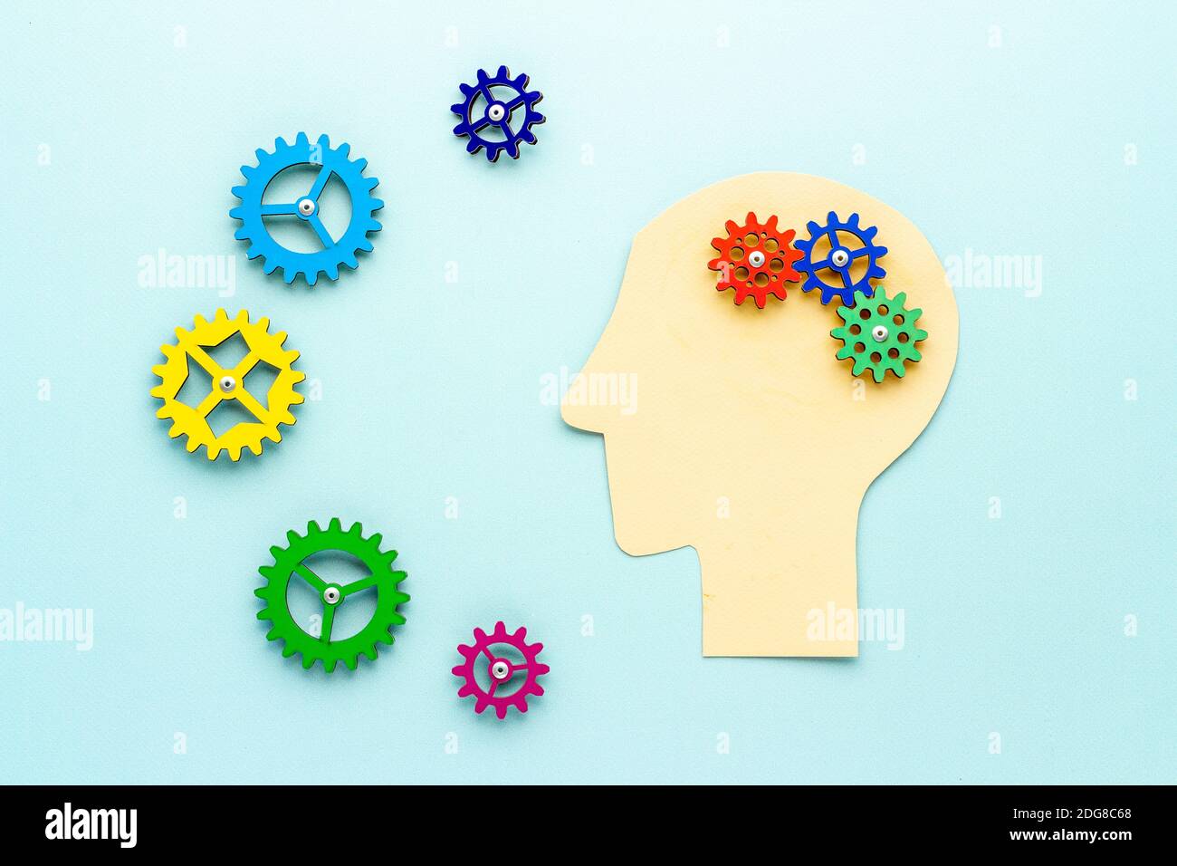 Idea concept. Human brain of gears on the paper head, top view Stock ...