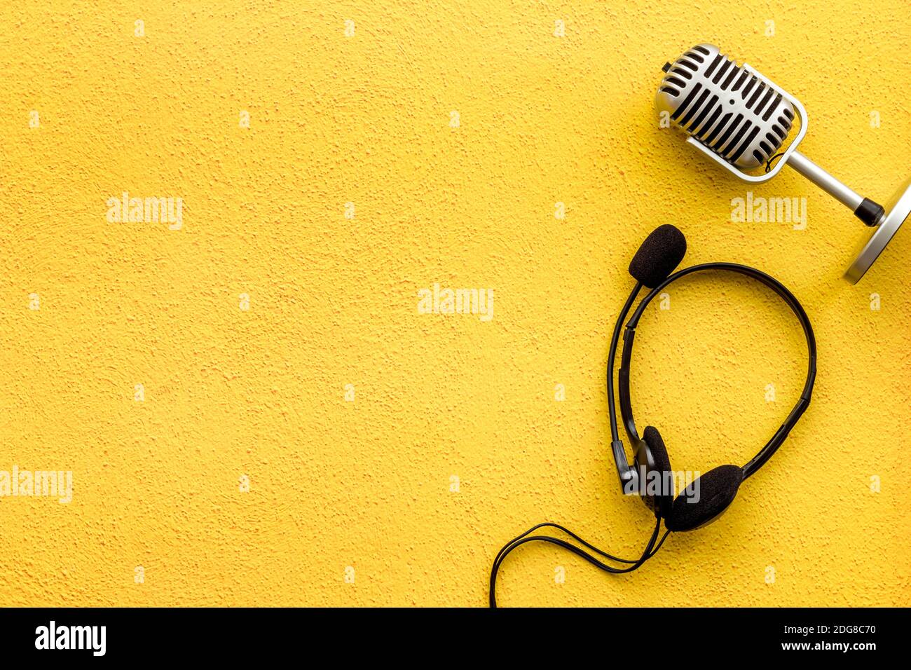 Studio microphone and headphones, top view. Recording podcast and ...