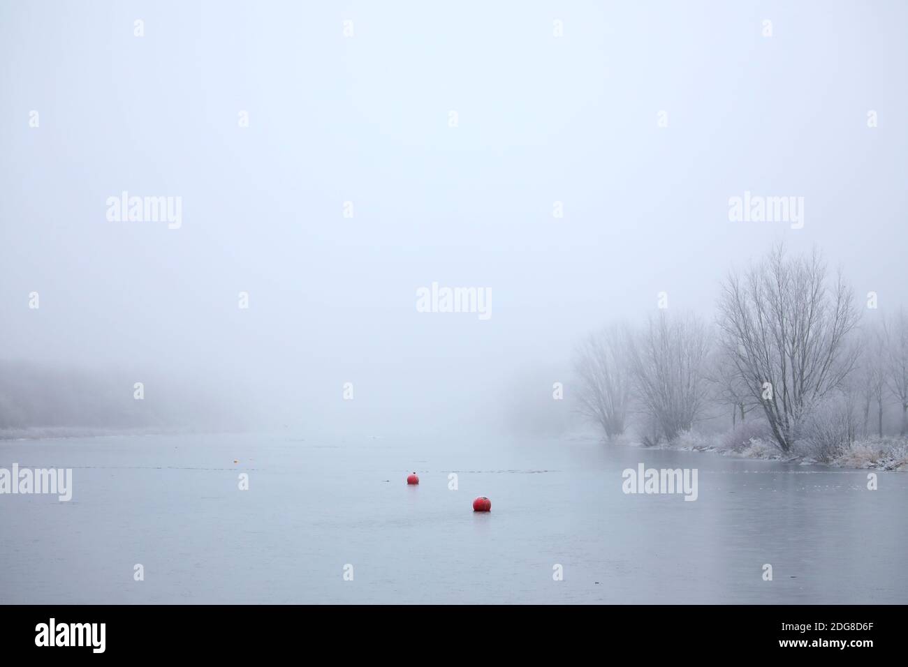 Peterborough, UK. 07th Dec, 2020. Marker buoys at the frozen rowing ...