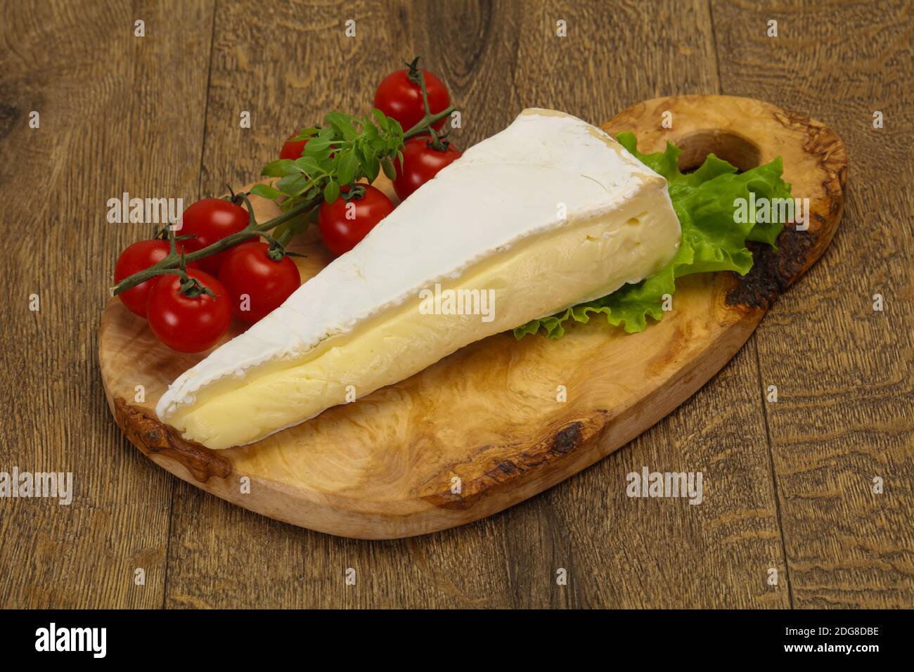 Brie cheese triangle served salad leaves Stock Photo - Alamy