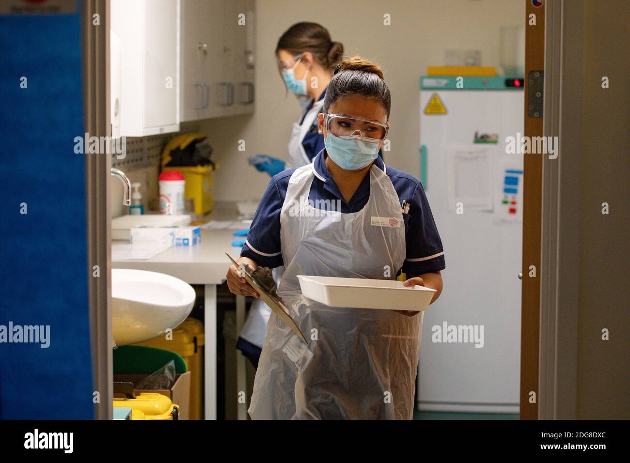 Nurse May Parsons carries a Pfizer/BioNTech covid-19 vaccine at ...